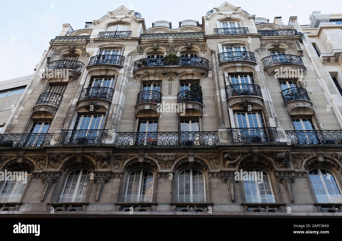 Traditional French house with typical balconies and windows. Paris ...