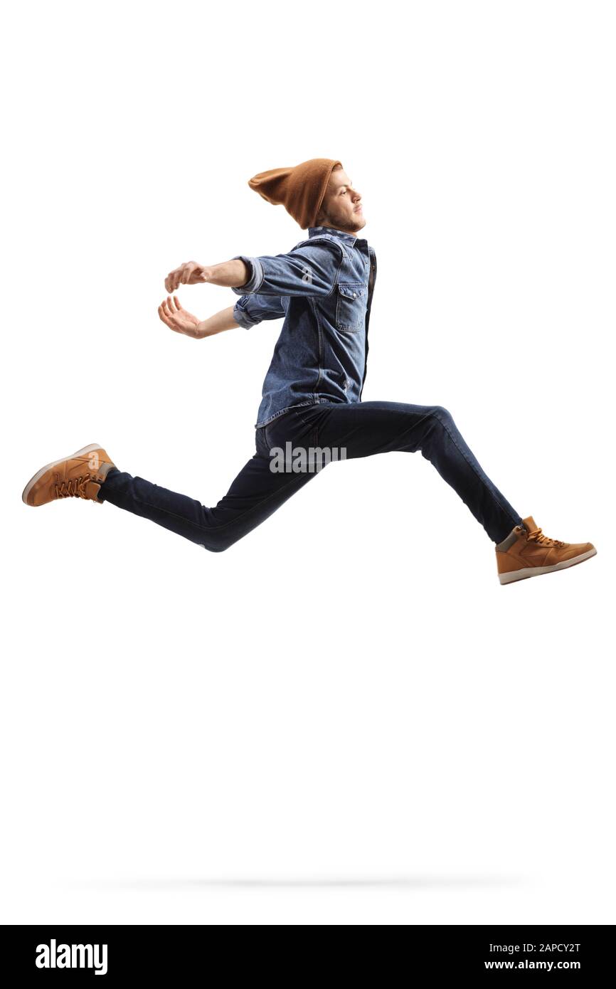 Guy in jeans performing a jump isolated on white background Stock Photo ...
