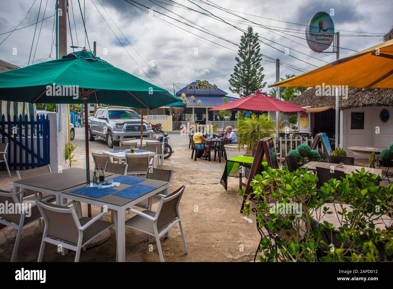 Tables of a bar on the streets of Bayahibe in the Dominican Republic 3 ...