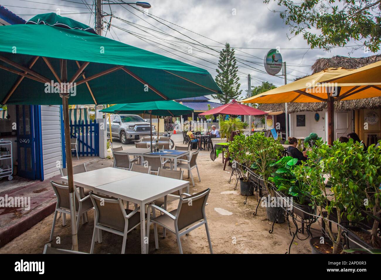 Tables of a bar on the streets of Bayahibe in the Dominican Republic 2 ...