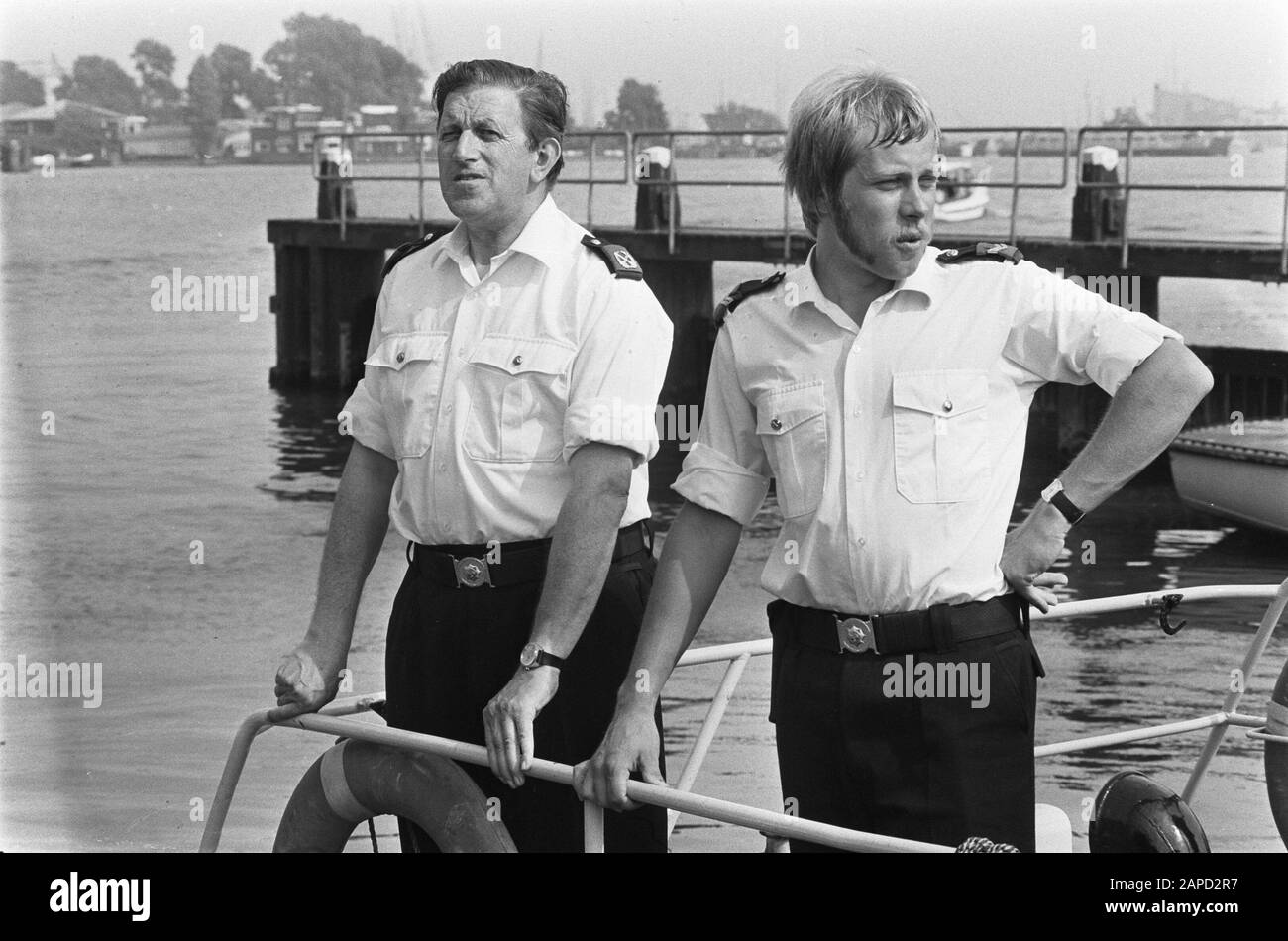 Heat wave continues Description: Police officers without tie with a ...