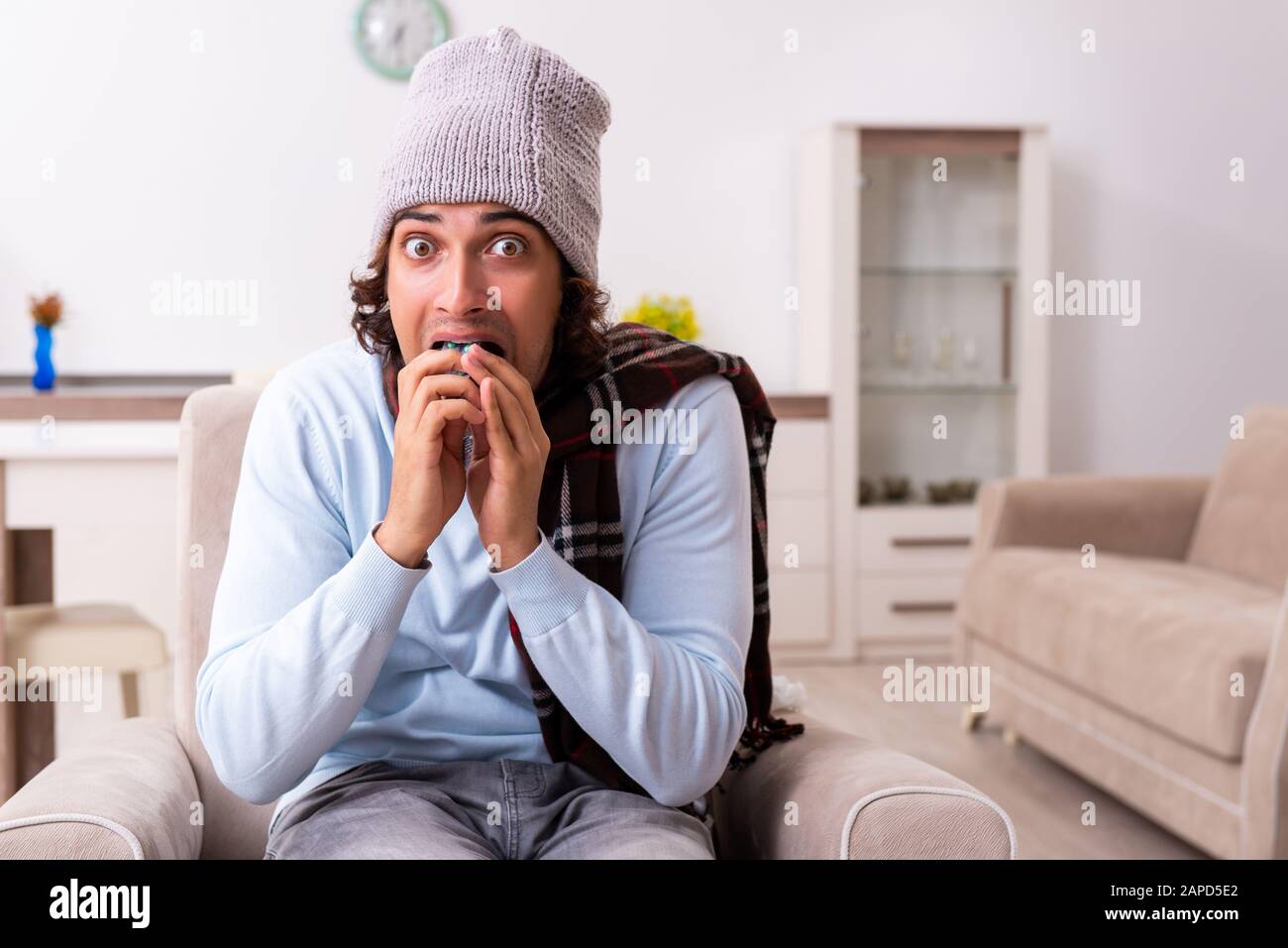 Young man suffering from flu at the home Stock Photo - Alamy