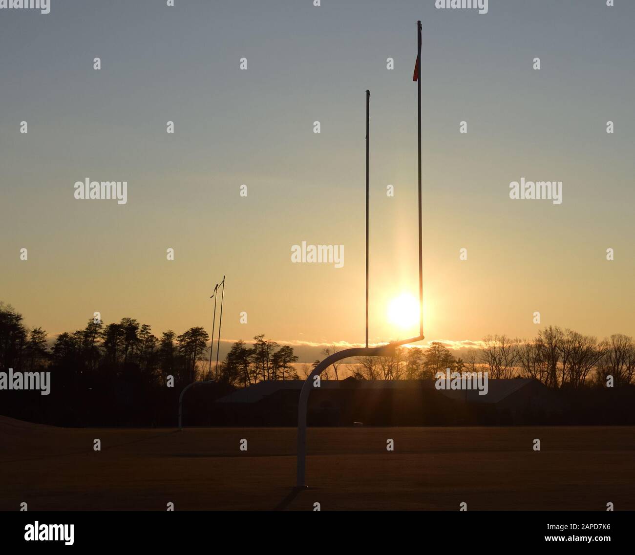Sunset through the uprights Stock Photo - Alamy