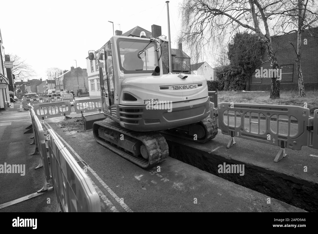 Excavator digging out a pipe trench Stock Photo - Alamy