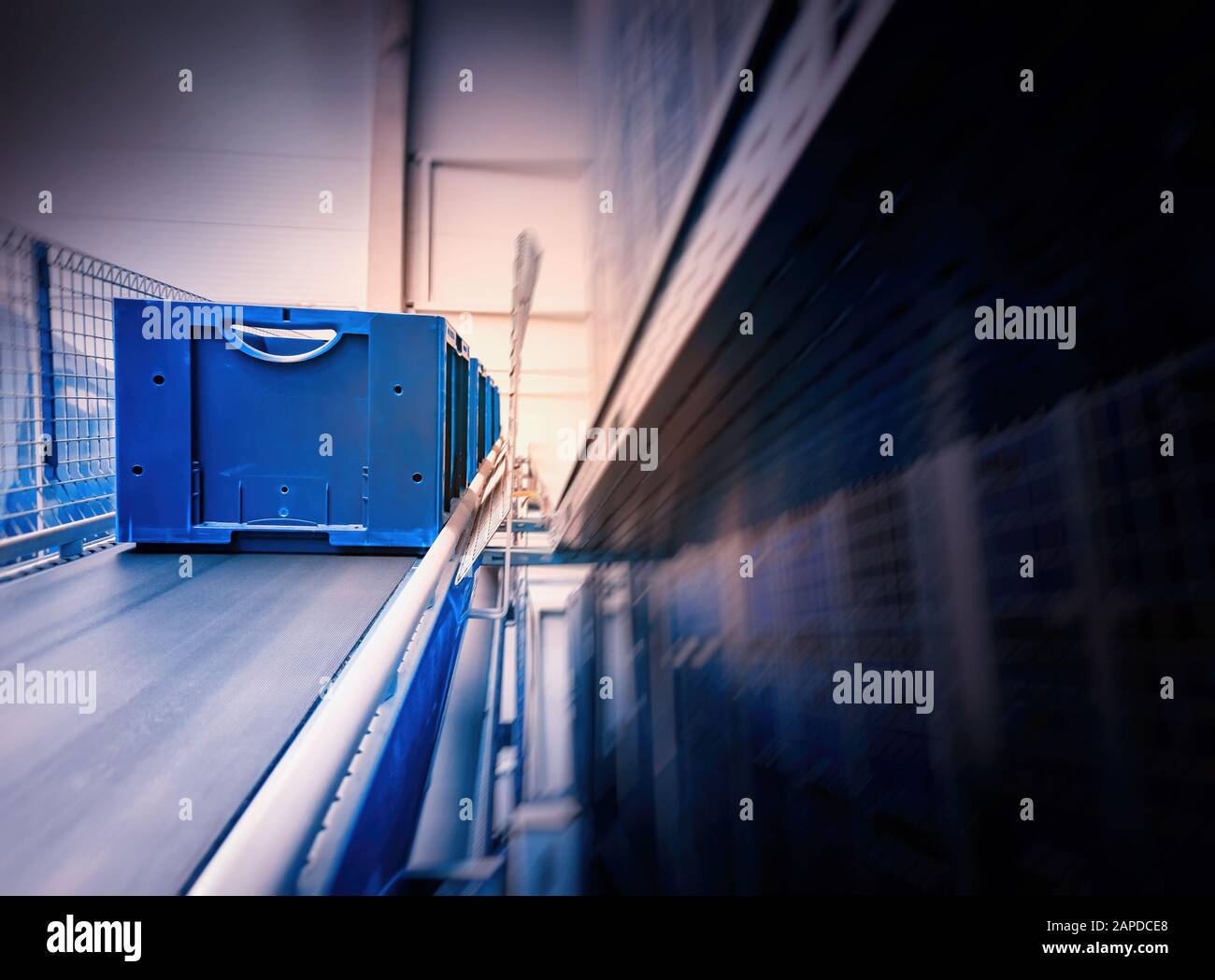 Blue boxes in a large, fully automated logistics warehouse run on a ...