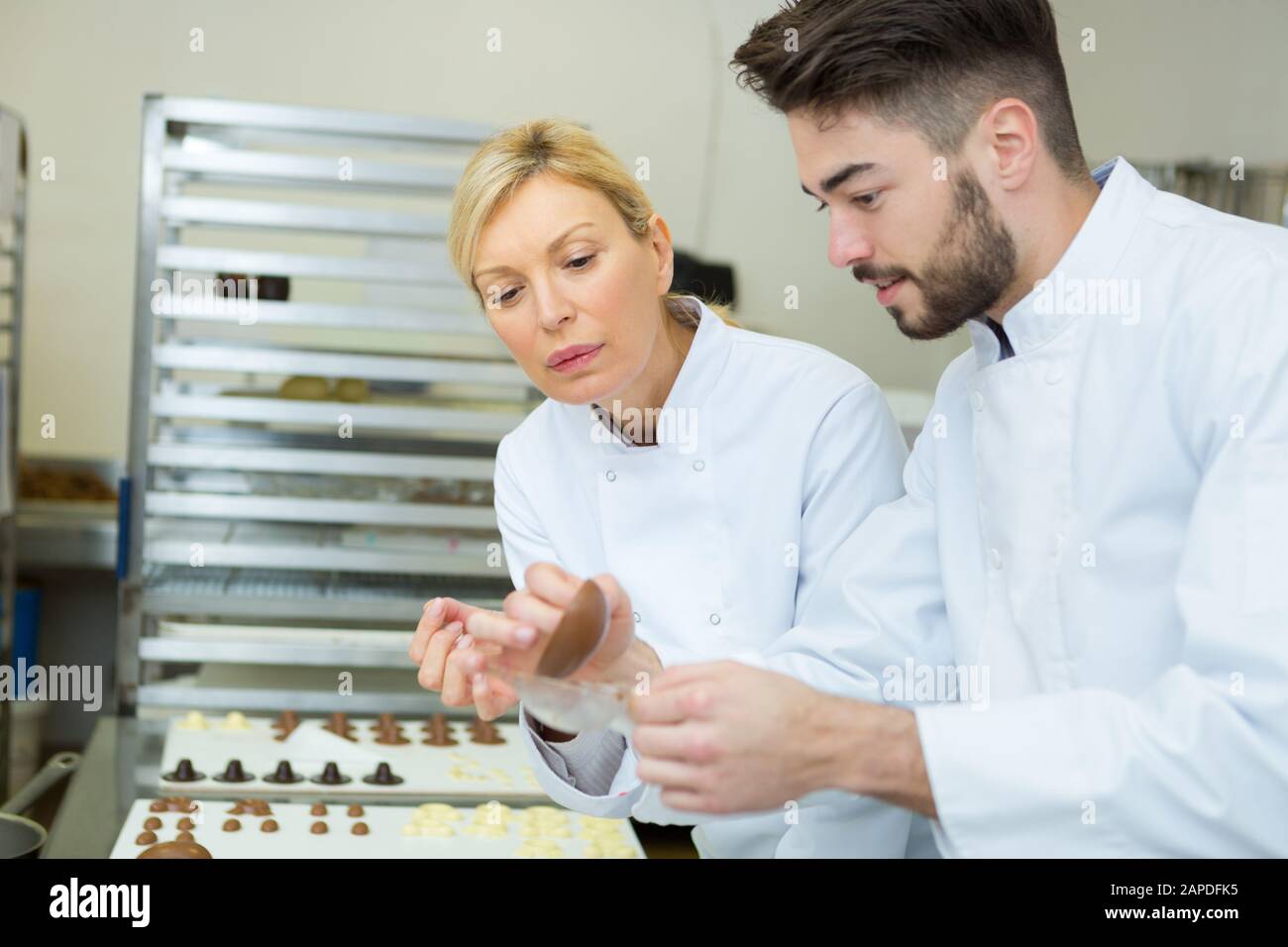 portrait of workers at chocolate factory Stock Photo - Alamy