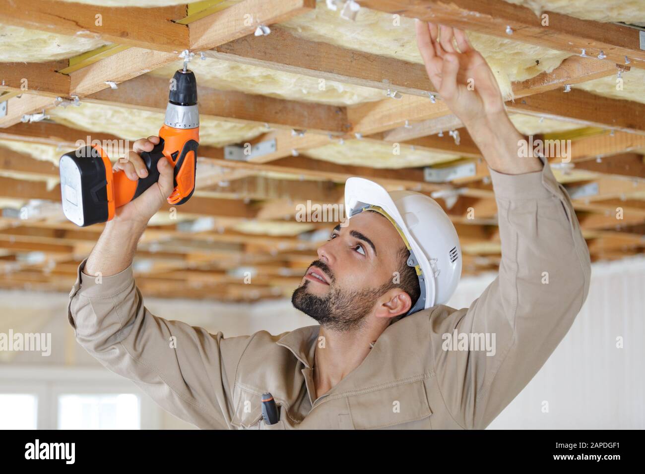 Man drilling ceiling hi-res stock photography and images - Alamy