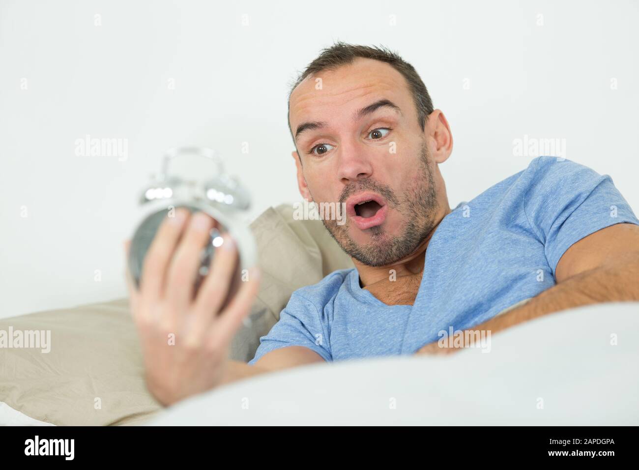 Man alarm clock shock hi-res stock photography and images - Alamy