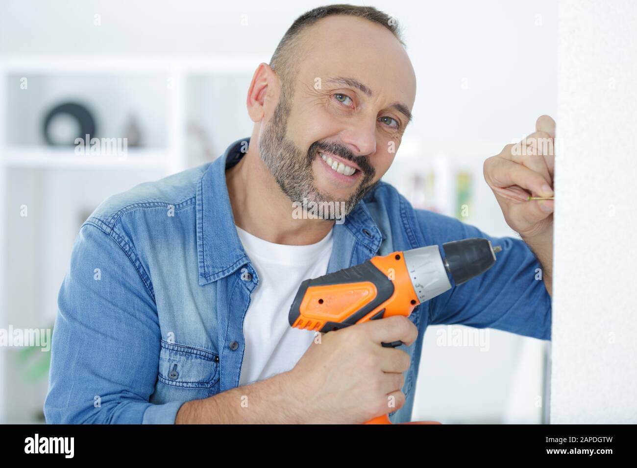 Two men drilling hole hi-res stock photography and images - Alamy