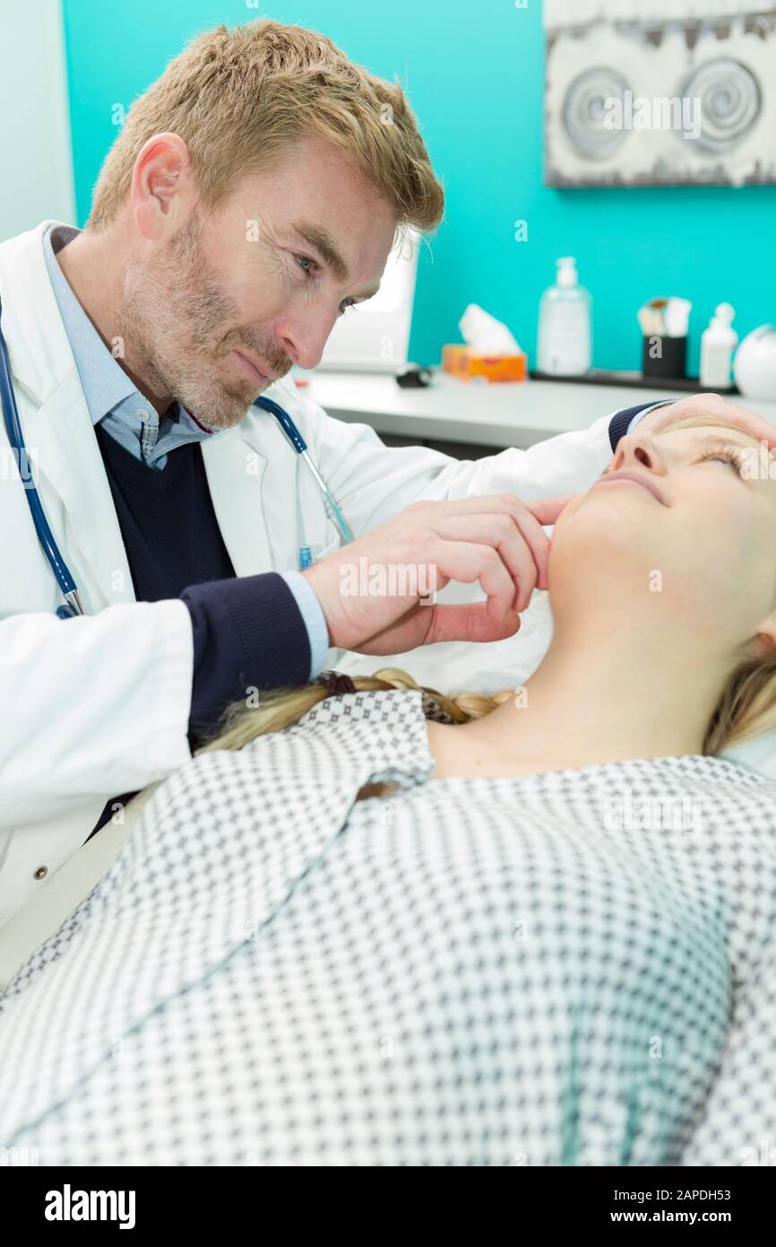 dermatologist checking patient skin on the face Stock Photo - Alamy
