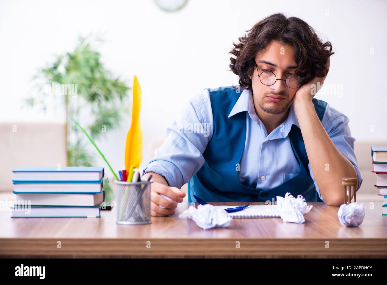 The young writer working on his new work Stock Photo - Alamy