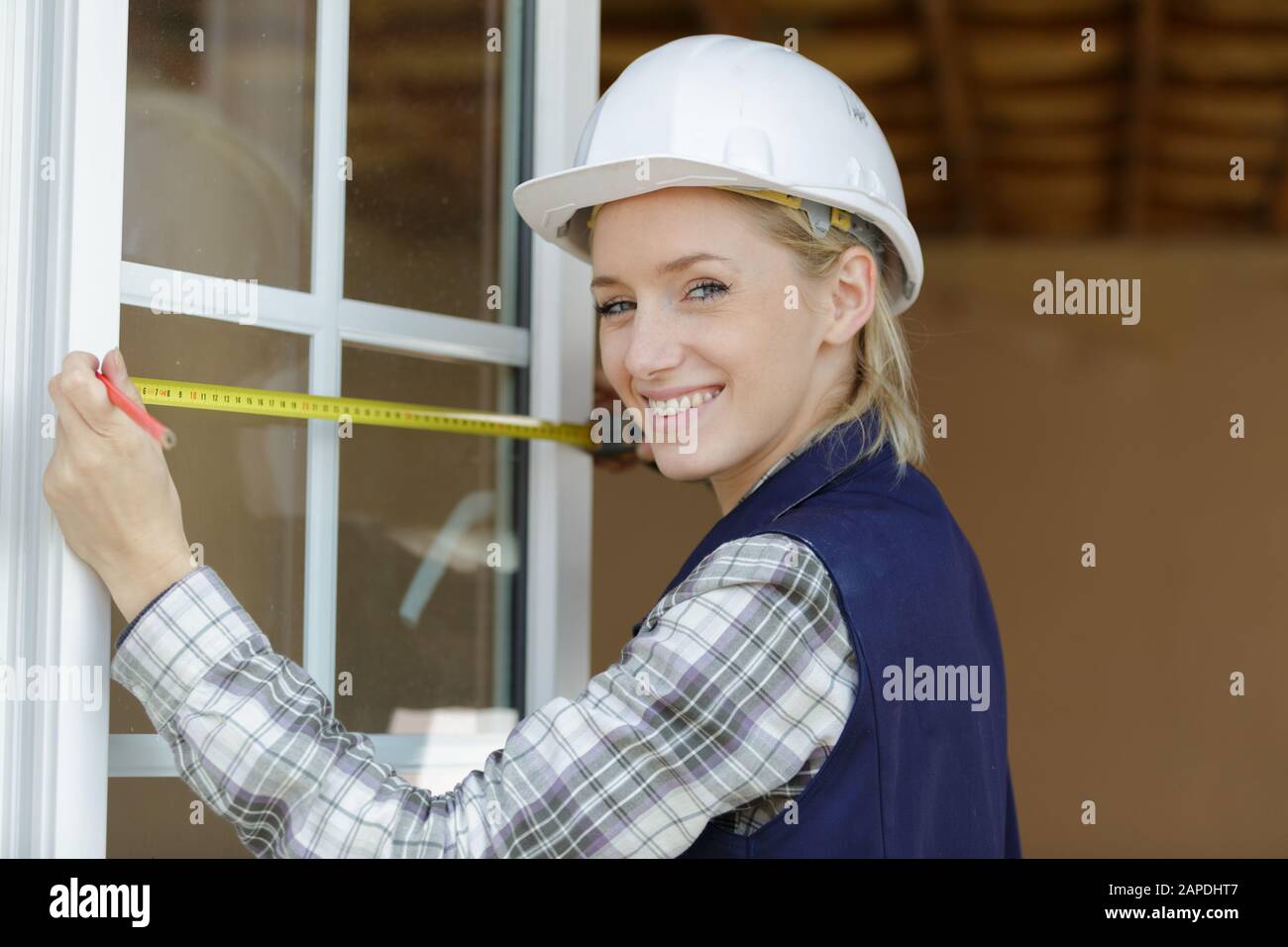 Happy female builder pencil hi-res stock photography and images - Alamy