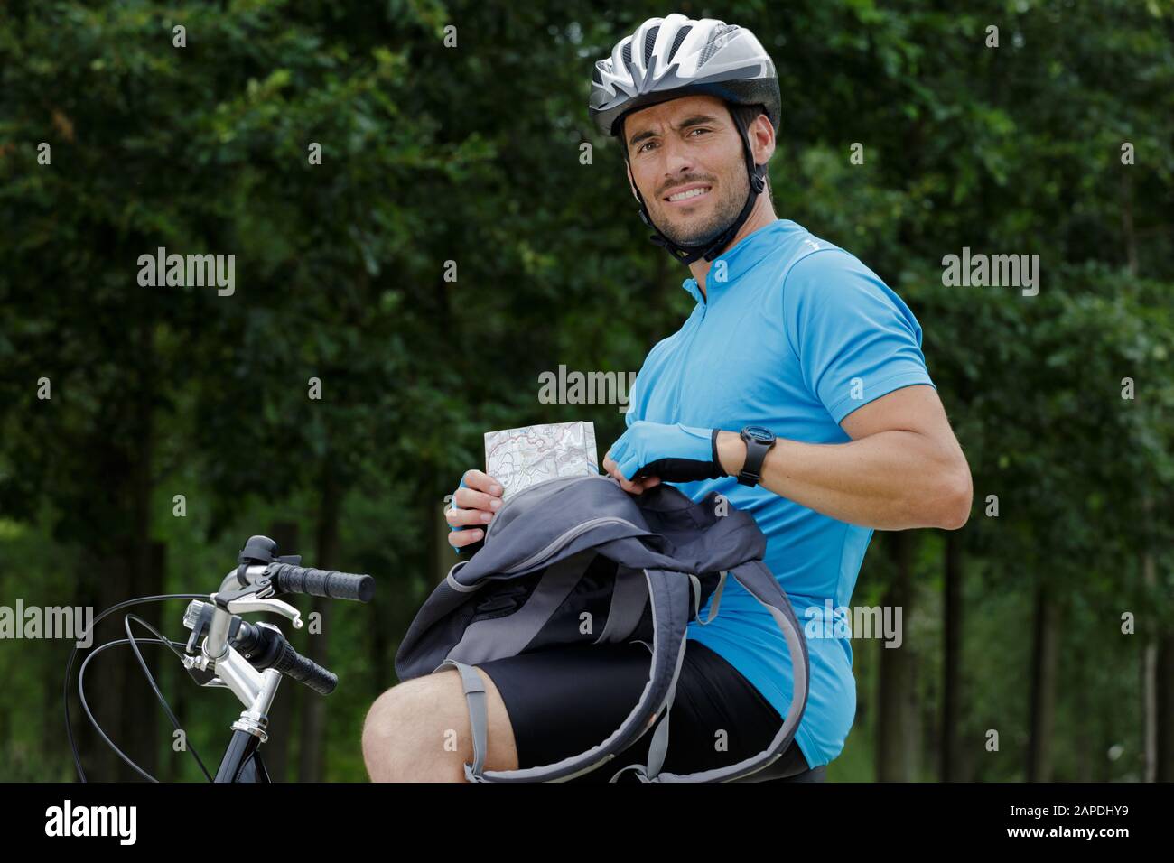 man keeping map in bag Stock Photo - Alamy