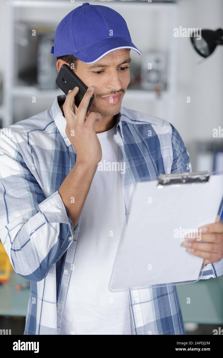 mechanic calls as a car customer Stock Photo - Alamy