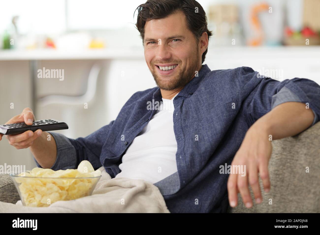 remote tv control and chips Stock Photo - Alamy