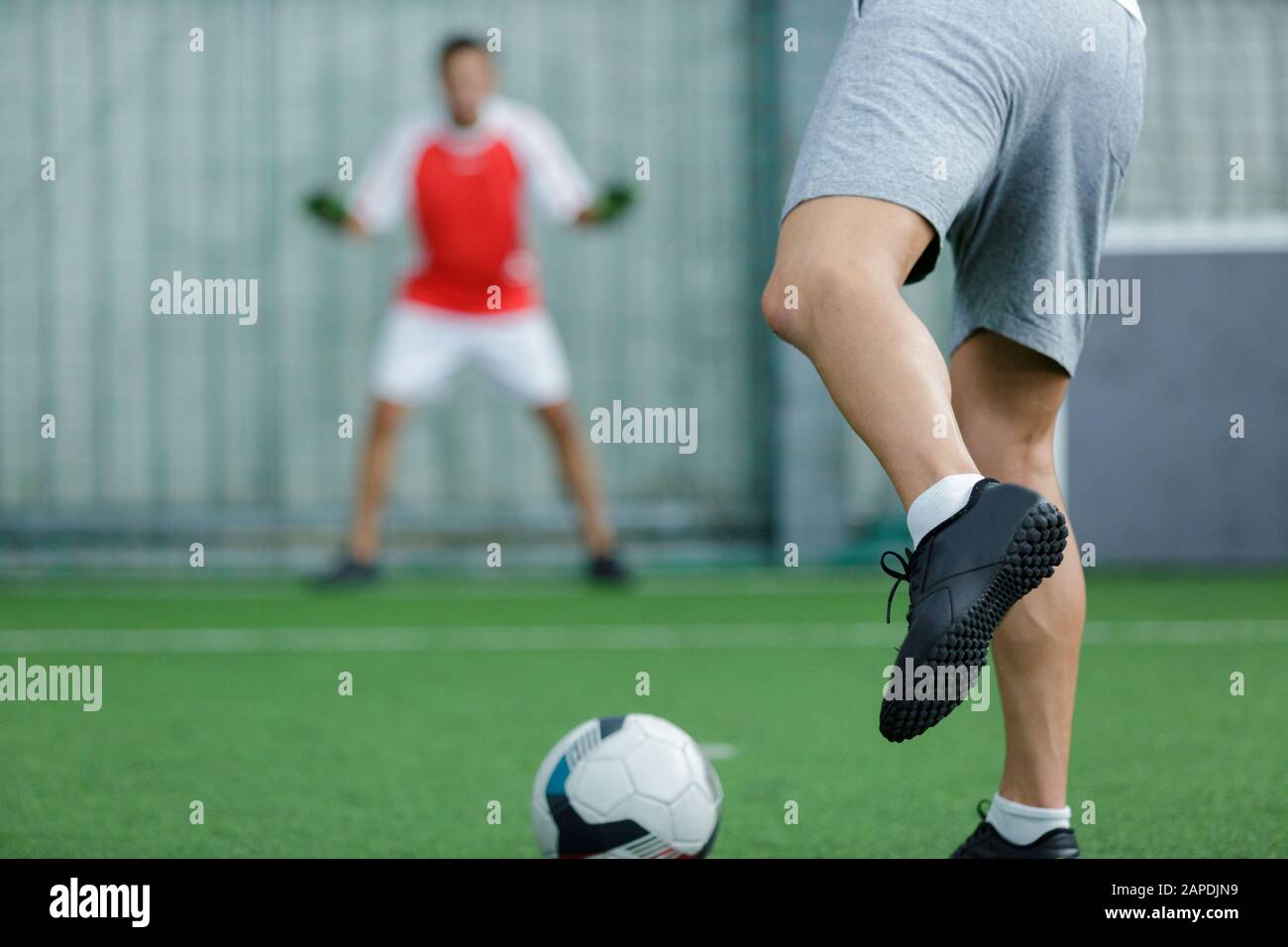 football player shooting for goal Stock Photo - Alamy