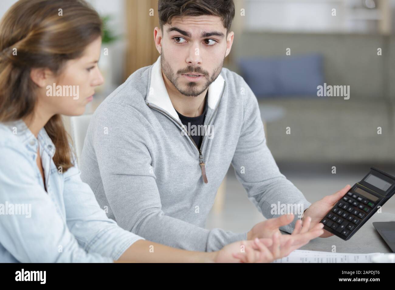 man showing budget and expense from number of calculator Stock Photo ...