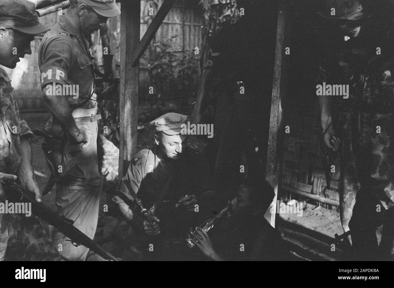 Infantry and armor KNIL Description: Ambarawa. An Indonesian man drinks ...