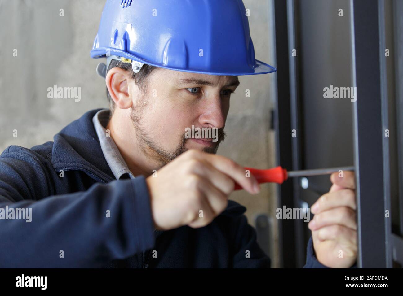 a man is fixing a window Stock Photo - Alamy