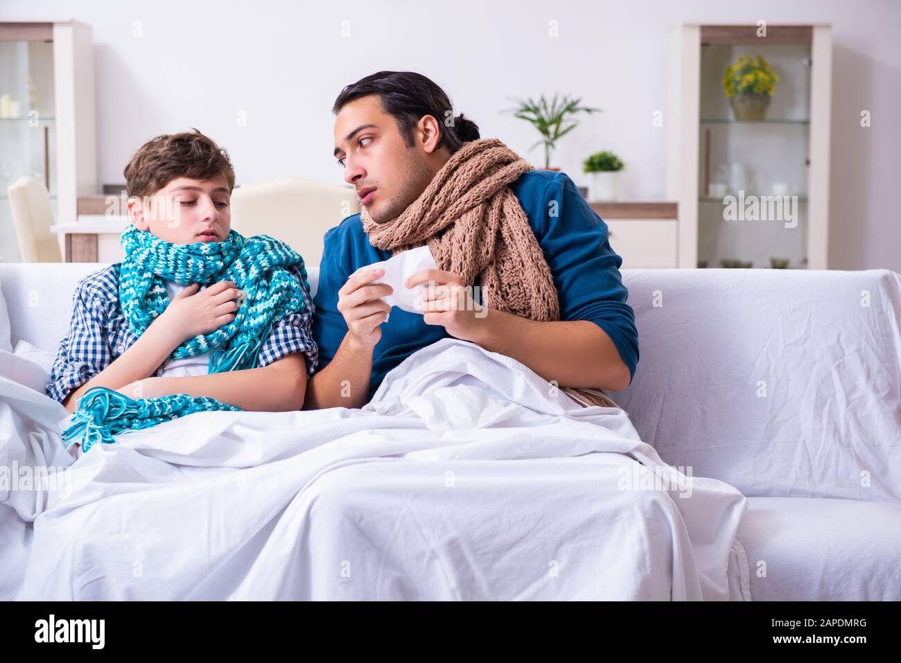 The young father caring for sick son Stock Photo - Alamy