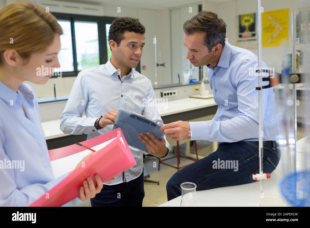 group of students using a 3d printer and a laptop Stock Photo - Alamy