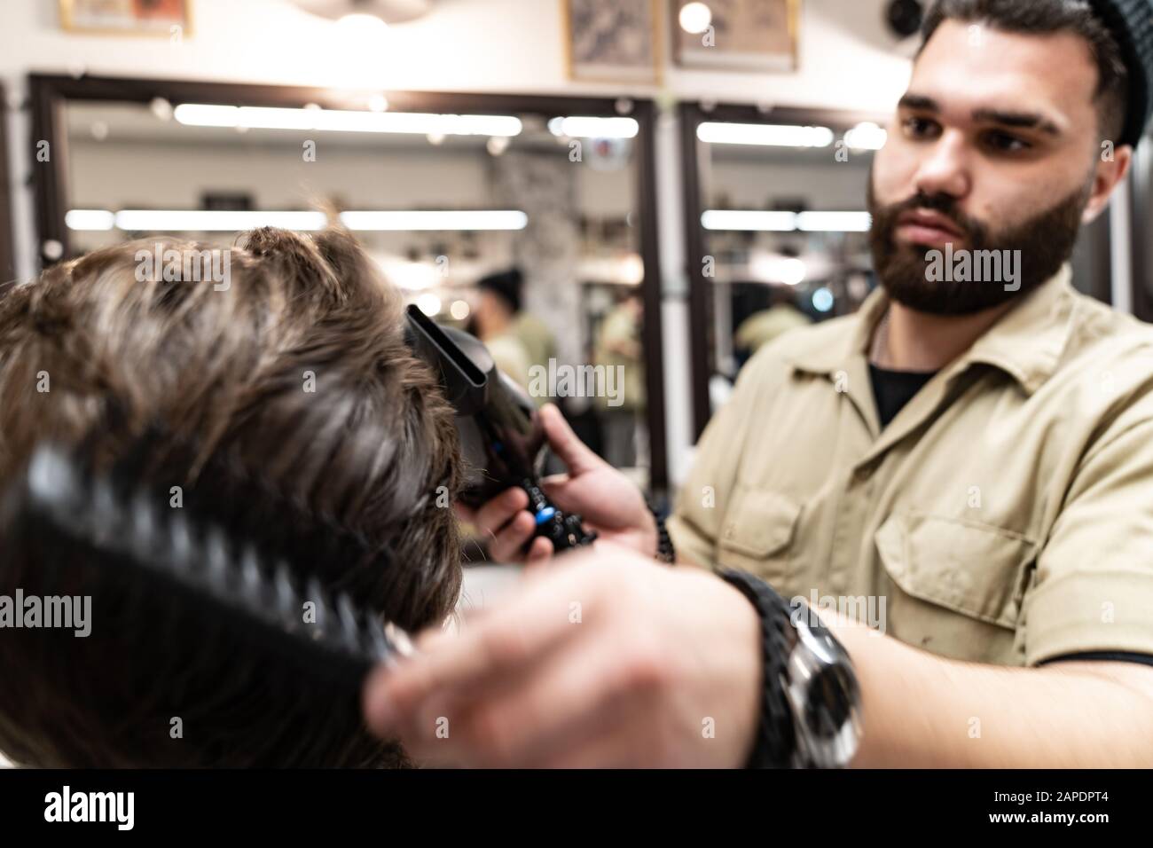 Creating a new hairstyle. Creative haircut from a hairdresser Stock ...