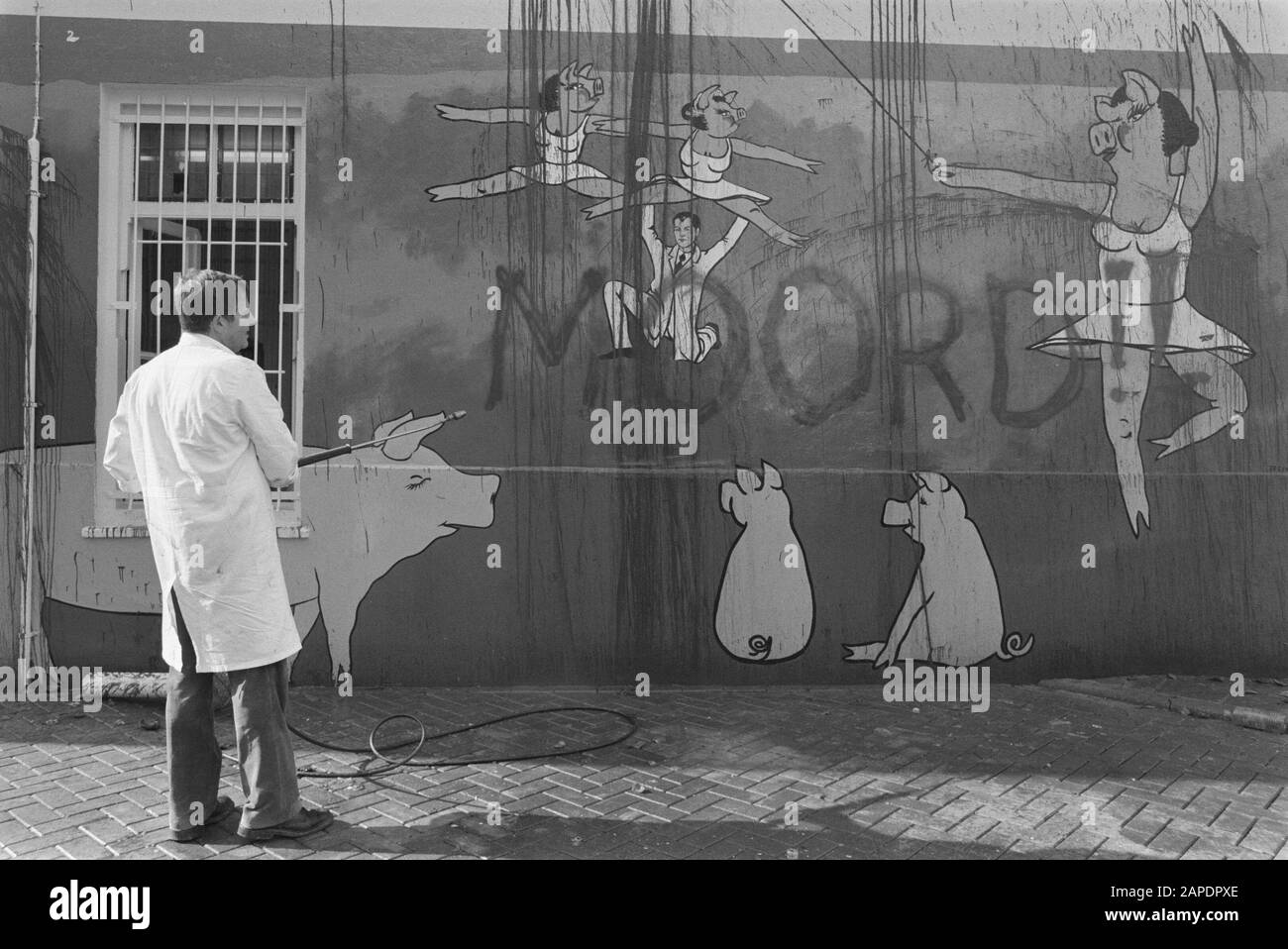 Amsterdamse butcher Ton Veenhof tries to clean painted mural of dancing ...