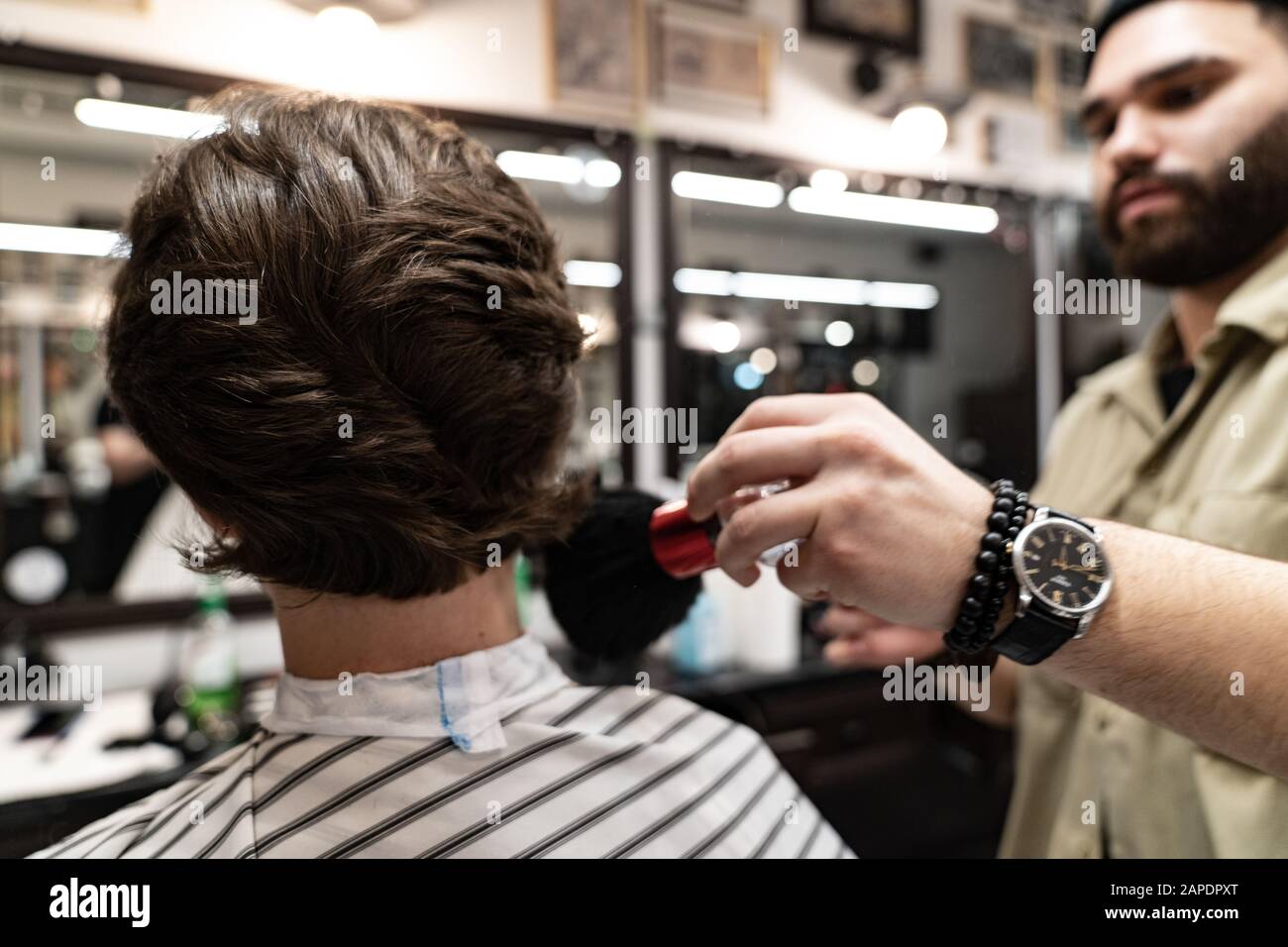 Creating a new hairstyle. Creative haircut from a hairdresser Stock ...
