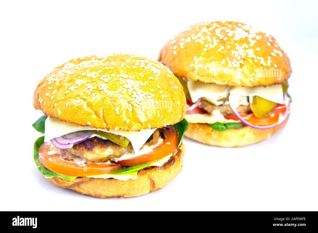 Two hamburgers isolated on a white background front views Stock Photo ...