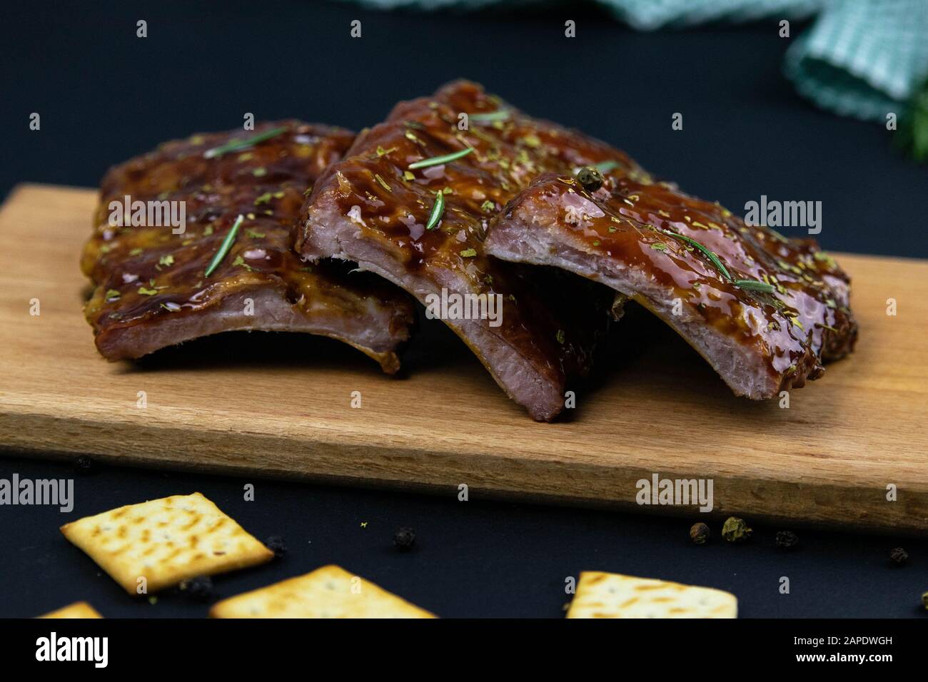 Barbecue Pork Spare Ribs as side view with basil and tomatoes and hot ...