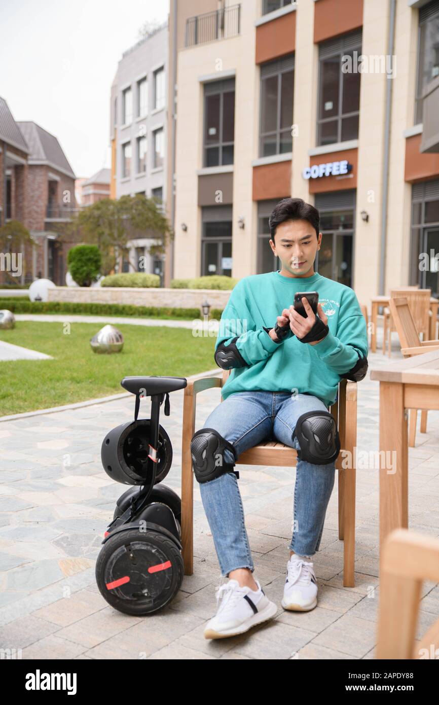 Smart mobility life concept, young man using an electric car, electric ...