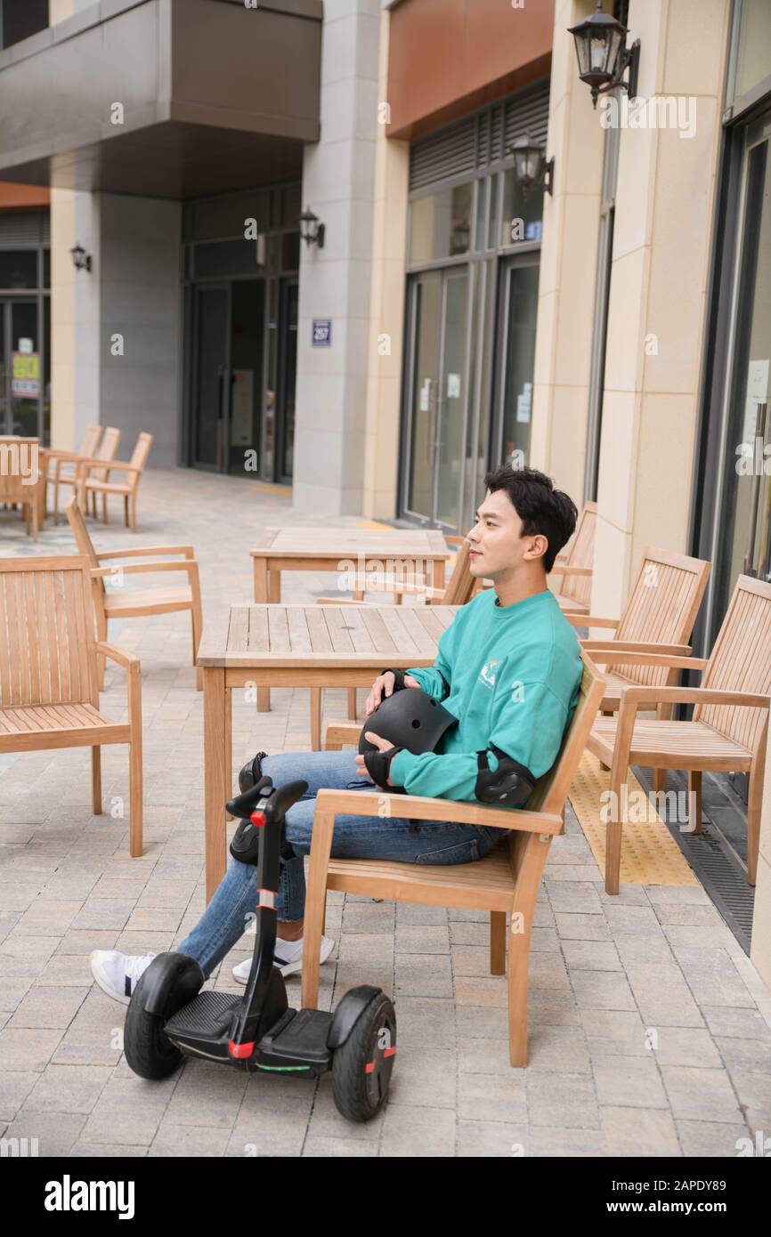 Smart mobility life concept, young man using an electric car, electric ...