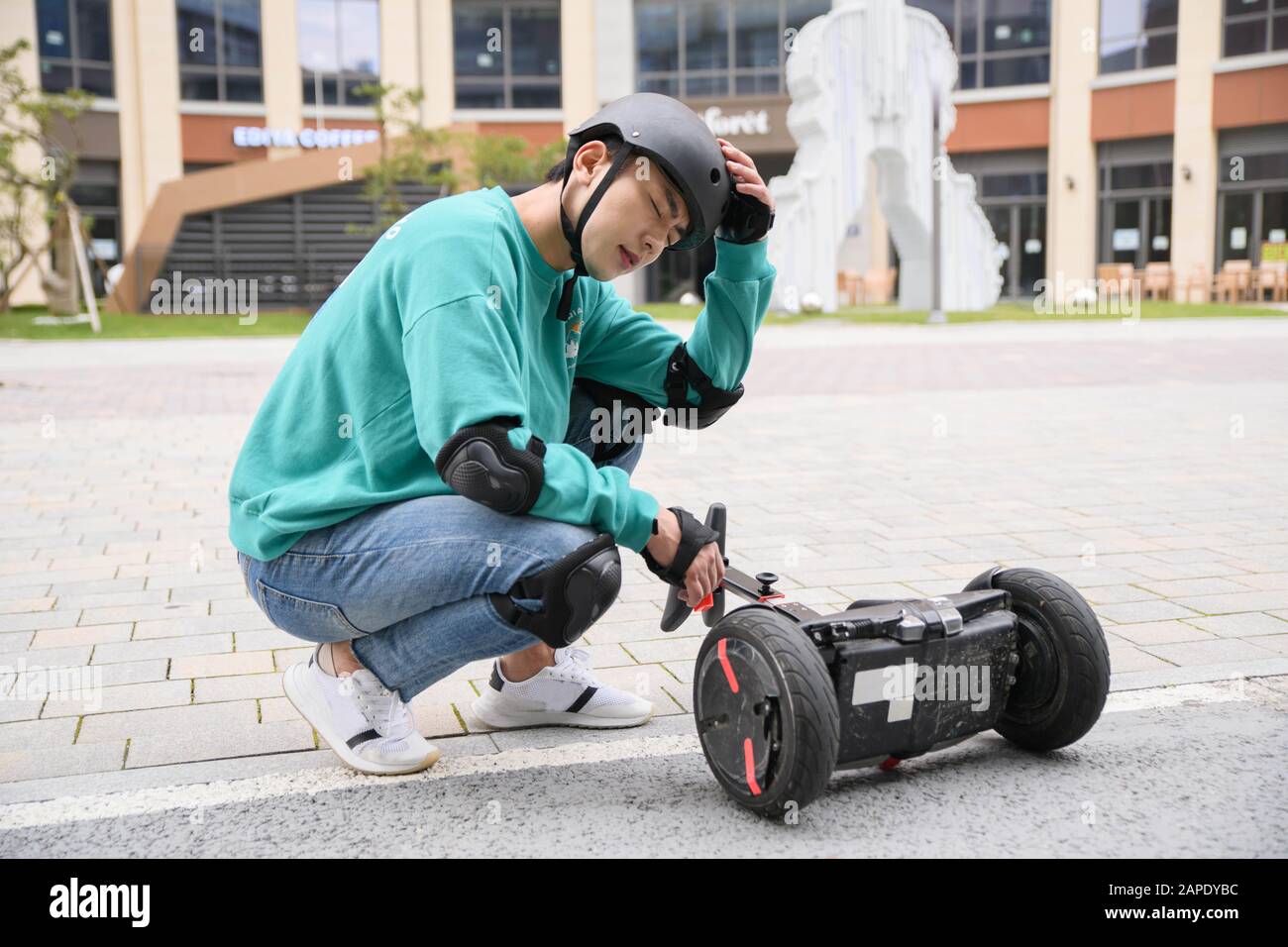 Smart mobility life concept, young man using an electric car, electric ...