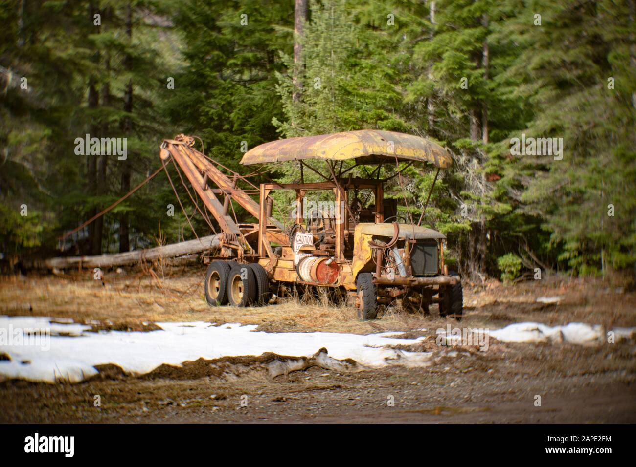 A old, rusty Idaho Logging Jammer winch truck, in wooded area, west of ...