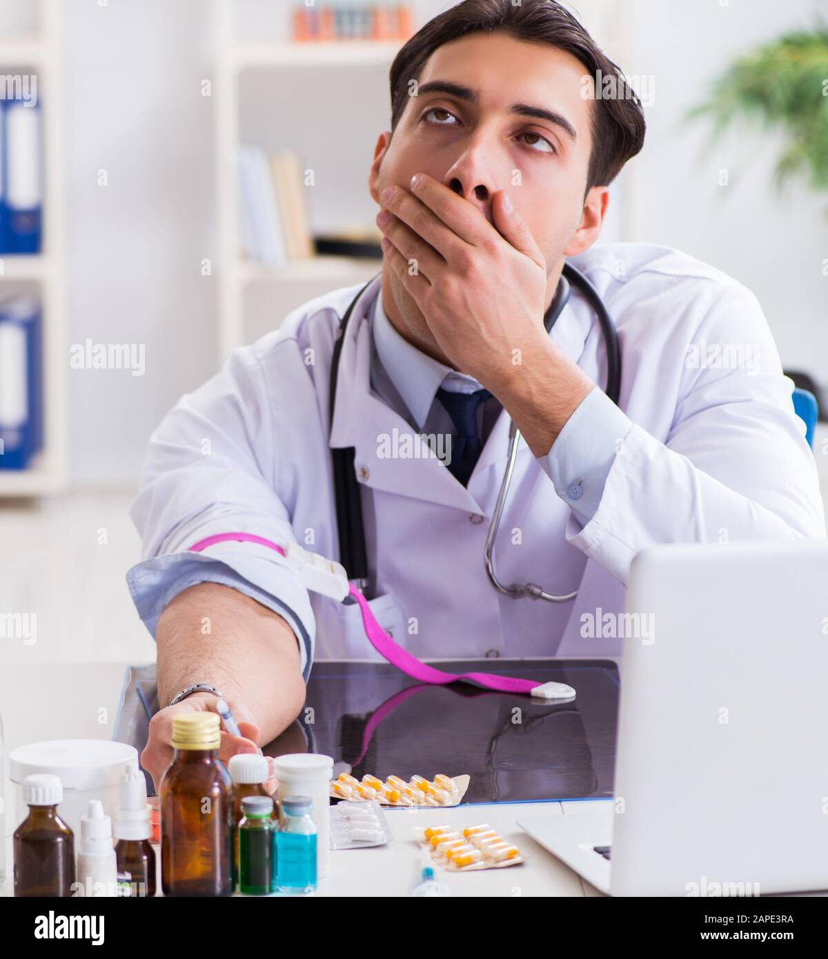 The doctor drug addict in the hospital Stock Photo - Alamy