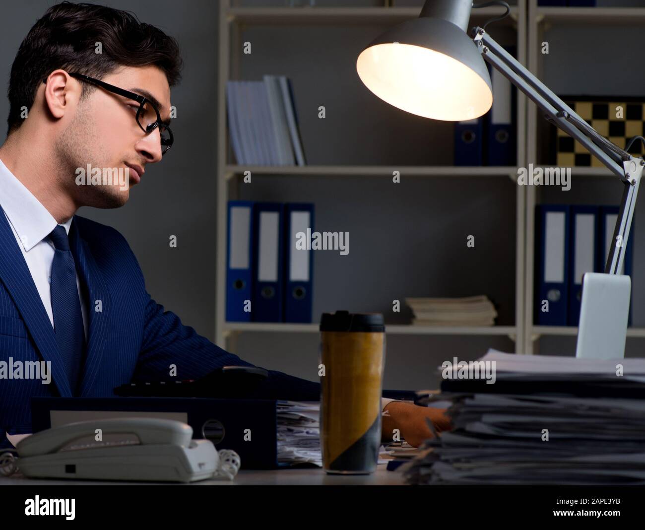 The employee working late to finish important deliverable task Stock ...