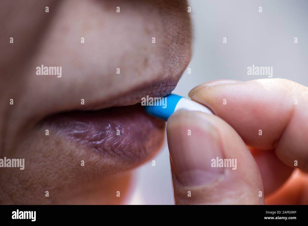 Swallowing capsule hi-res stock photography and images - Alamy