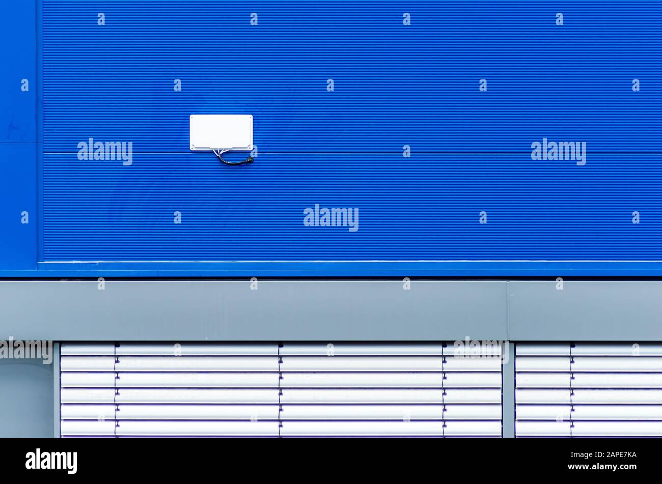 Blue wall with windows under the sunlight - a cool picture for ...