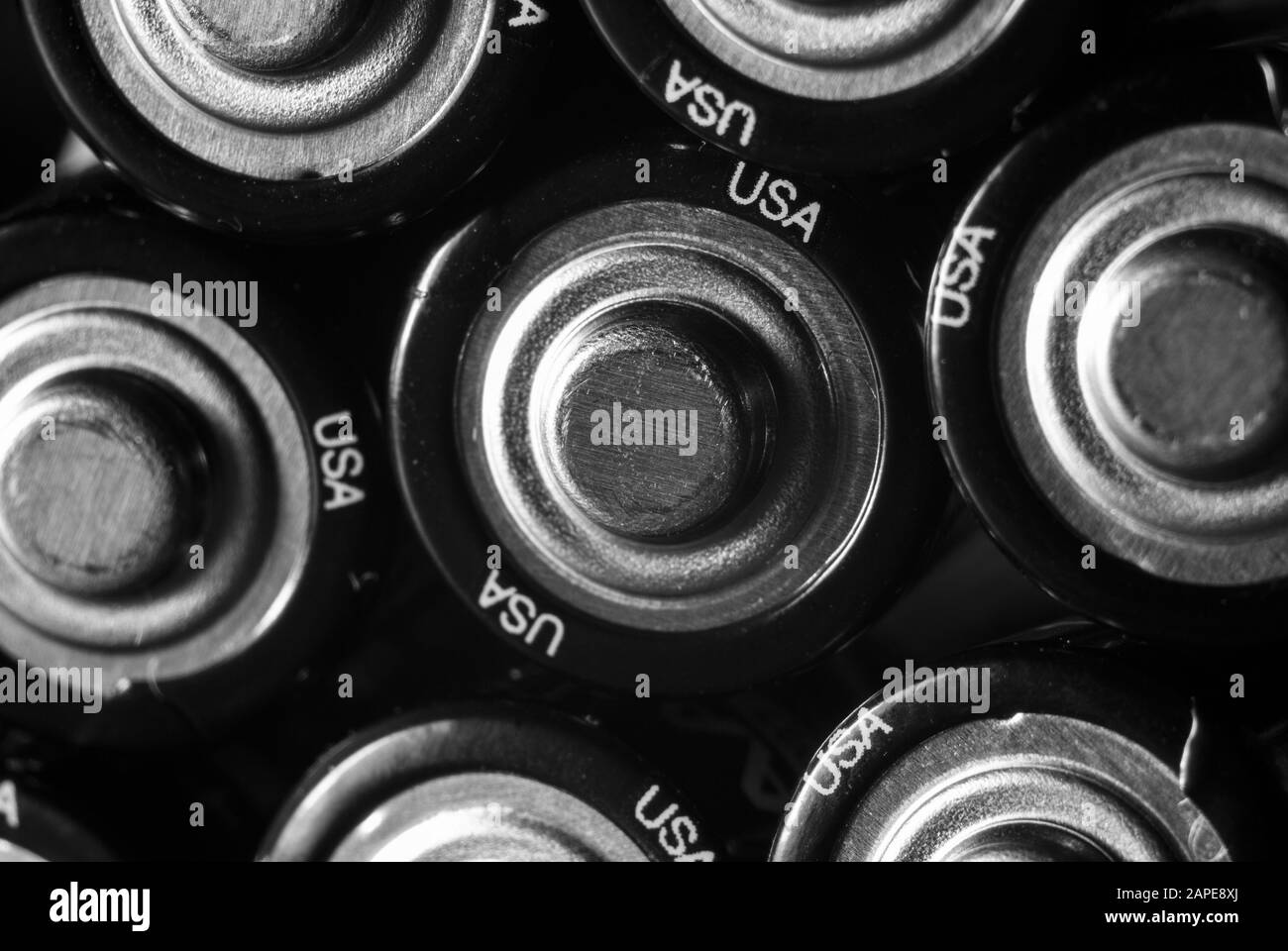 Closeup shot of metal batteries put next to each other in the dark ...