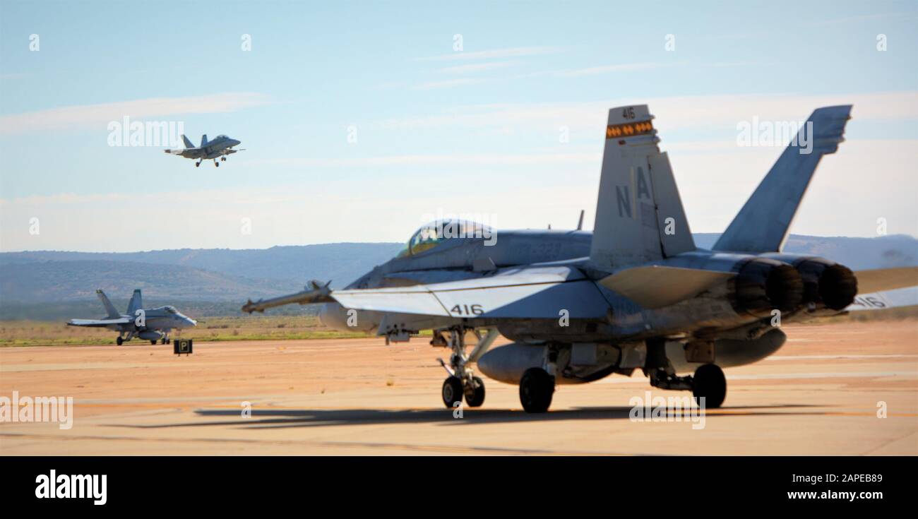 Three F/A-18 Super Hornets with the 3rd Marine Aircraft Wing land, taxi ...