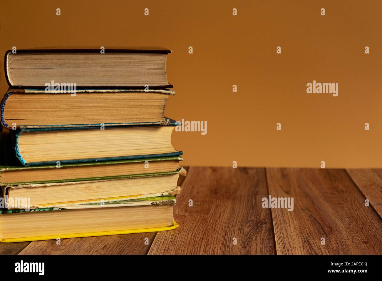 A stack of old books with yellow pages. Book binding. Knowledge and ...