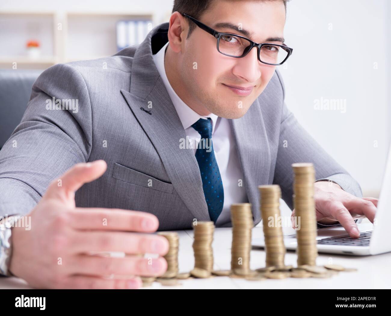 The man with coins in the office Stock Photo - Alamy