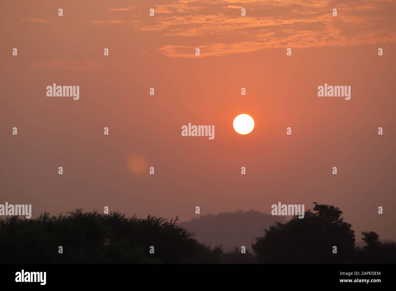 Bright orange sun sunrise over hi-res stock photography and images - Alamy
