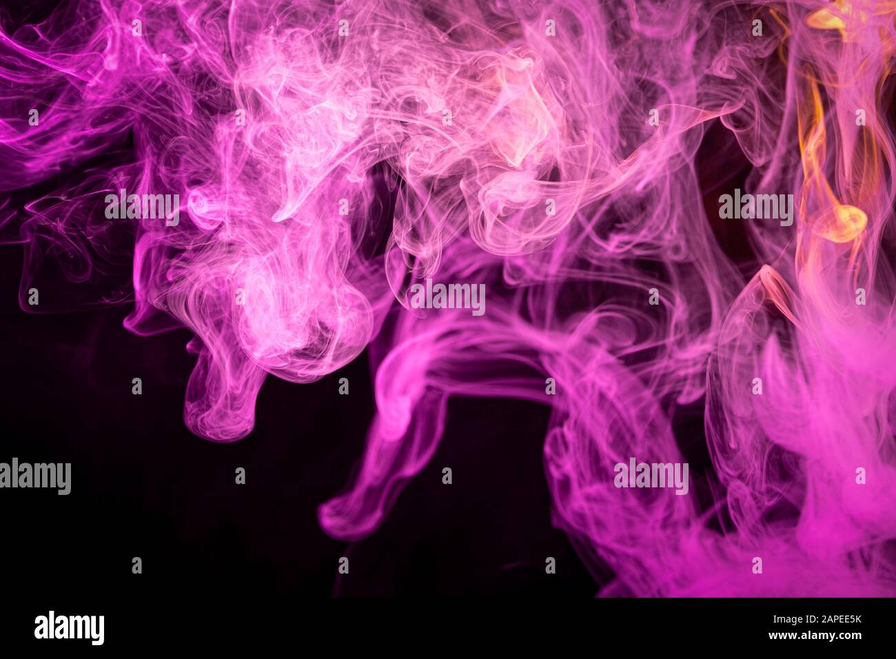 Colorful pink and red smoke on a black isolated background. Background ...