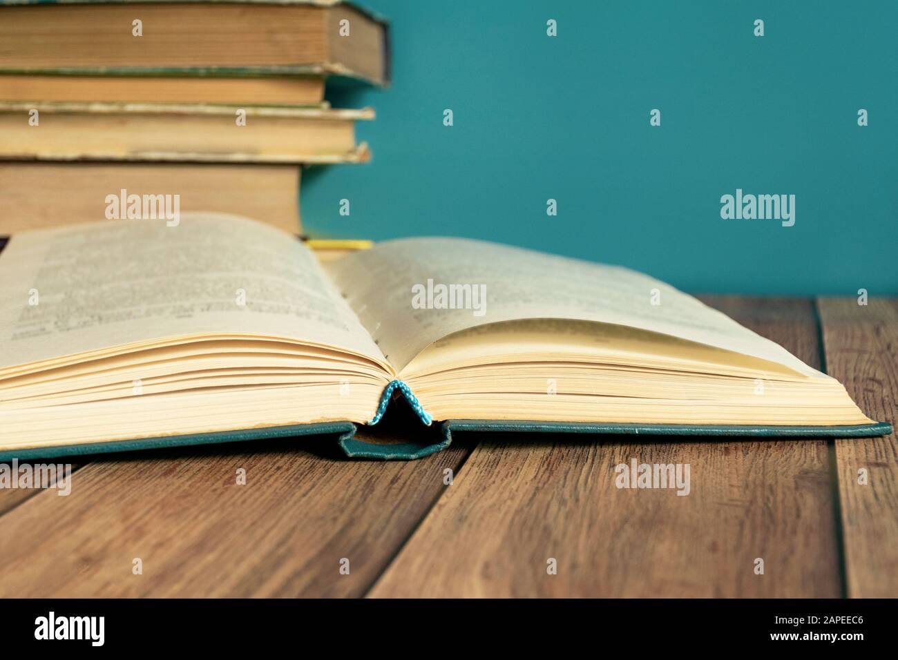 A stack of old books with yellow pages. Book binding. Knowledge and ...