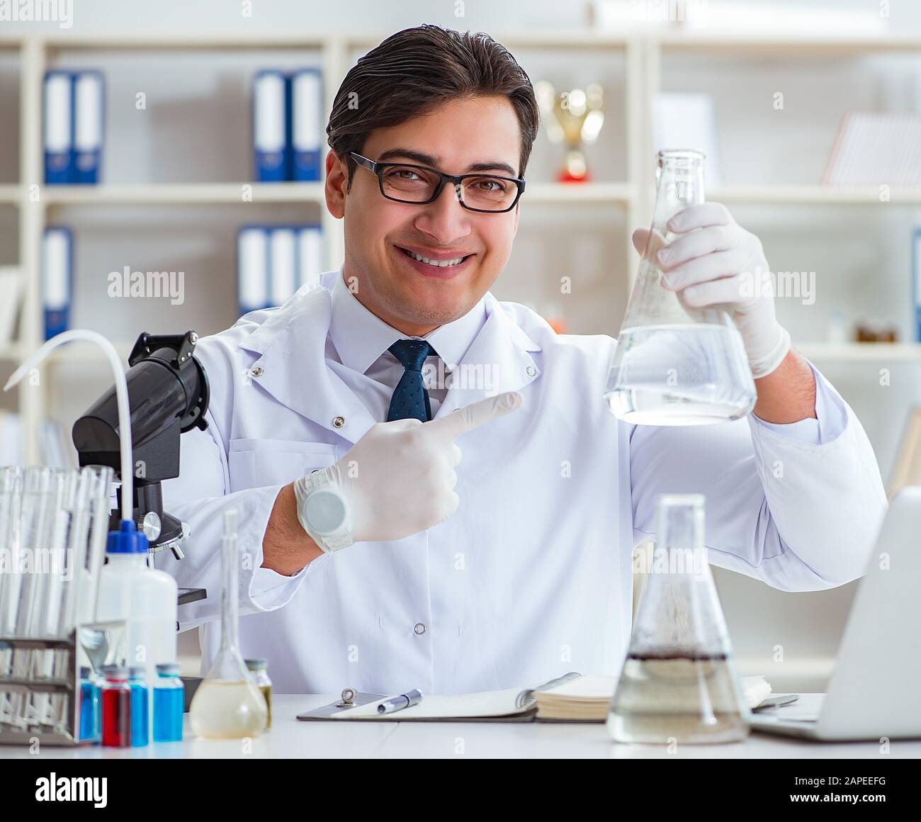 Young researcher scientist doing a water test contamination experiment ...