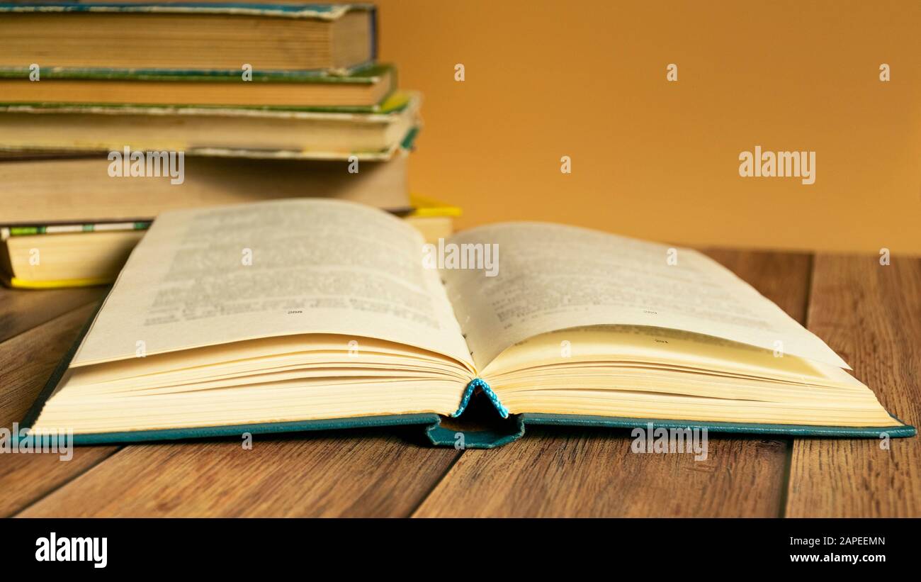 A stack of old books with yellow pages. Book binding. Knowledge and ...