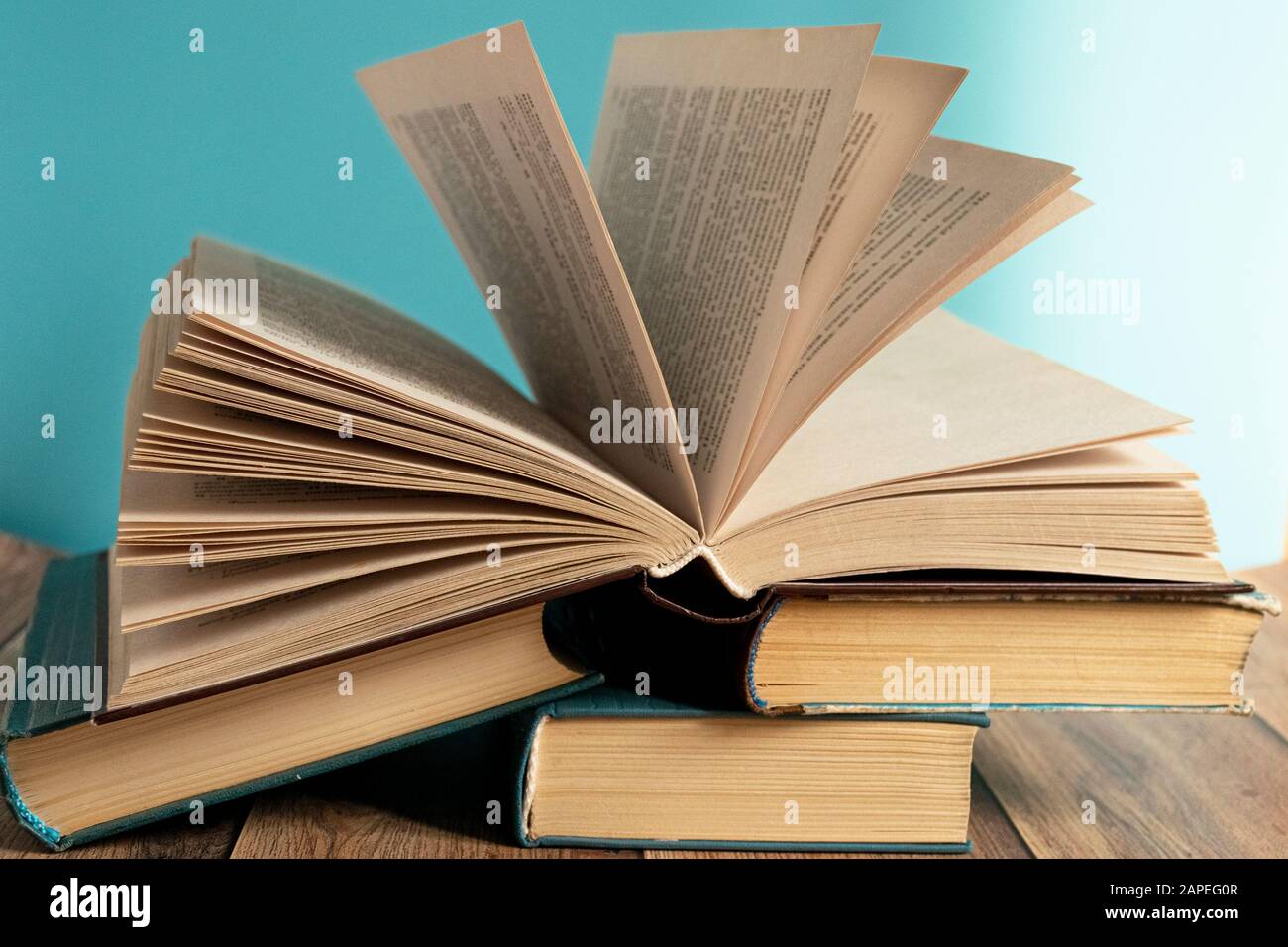 A stack of old books with yellow pages. Book binding. Knowledge and ...