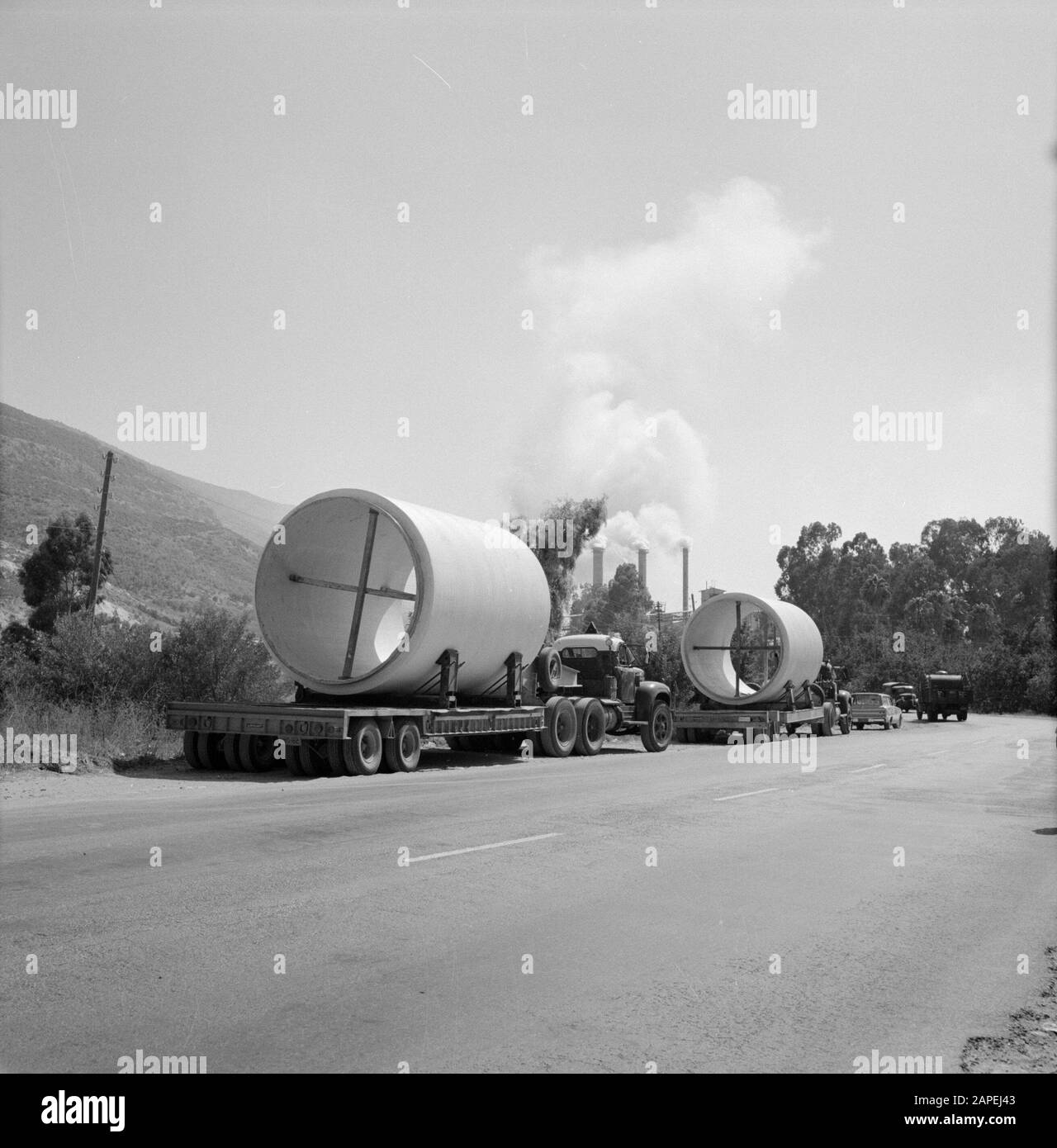 Concrete water pipes loaded on special transport cars. The tubes are ...