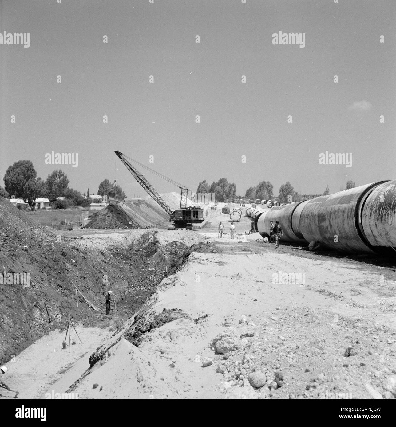 irrigation project in the Negev Desert. Pipes and a dragline at a ...